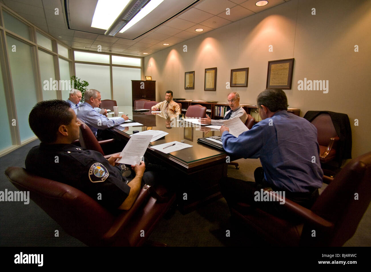The Santa Ana, California, Chief of Police (blue shirt) conducts a ...