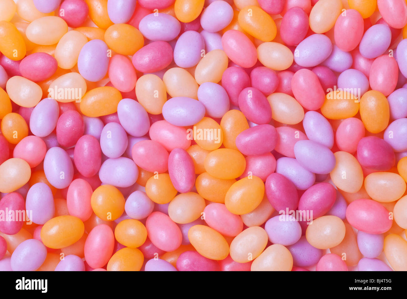 jelly beans multi colored backdrop or background Stock Photo - Alamy