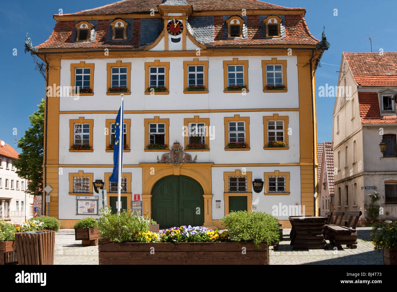 Building with clock and garden in front, Rottingen, Wurzberg, Bavaria ...