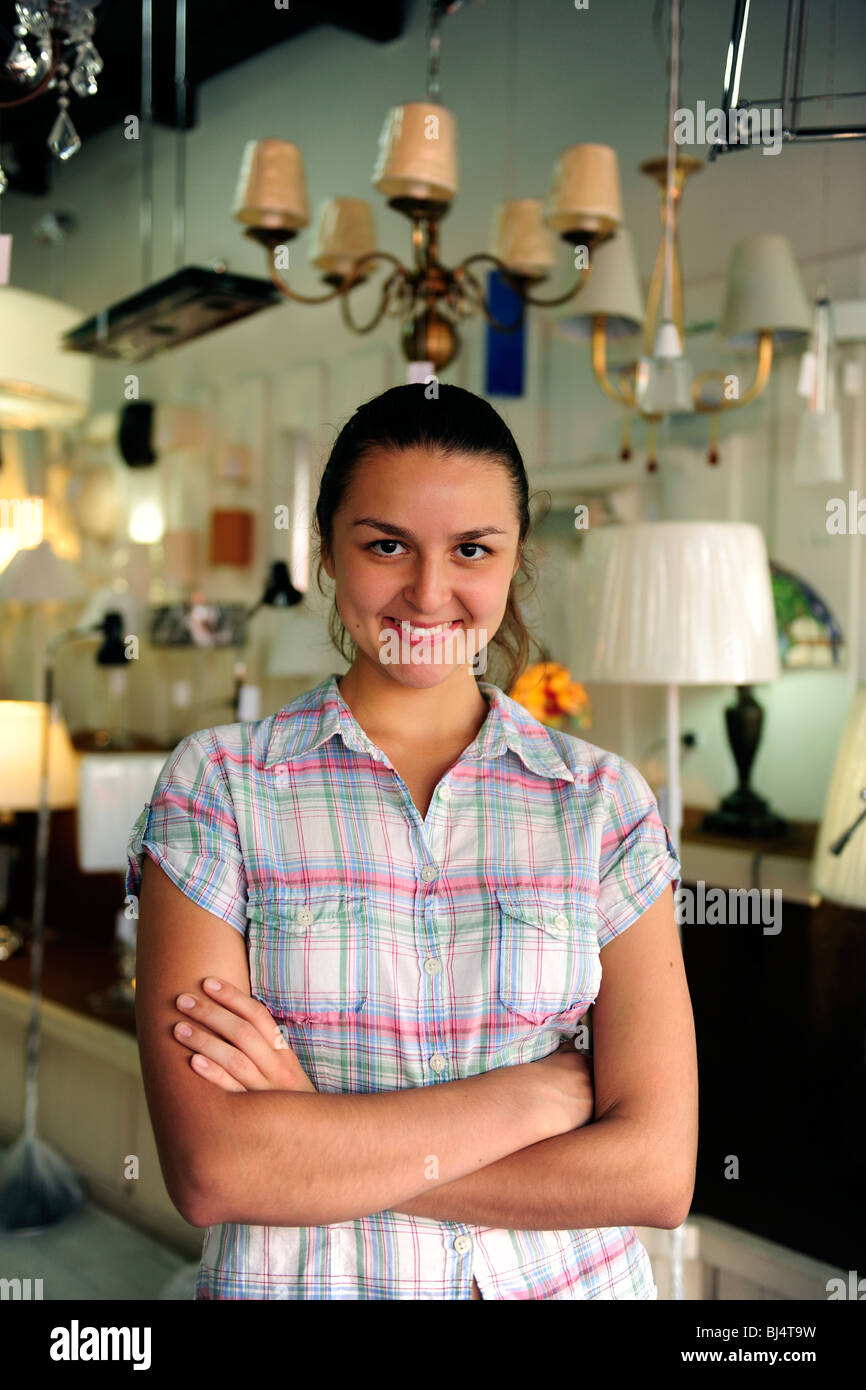 small business: happy owner of a lamp store Stock Photo - Alamy