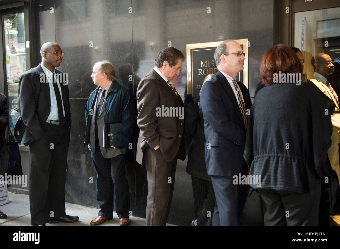 Job seekers line up for a job fair in midtown in New York on Wednesday ...