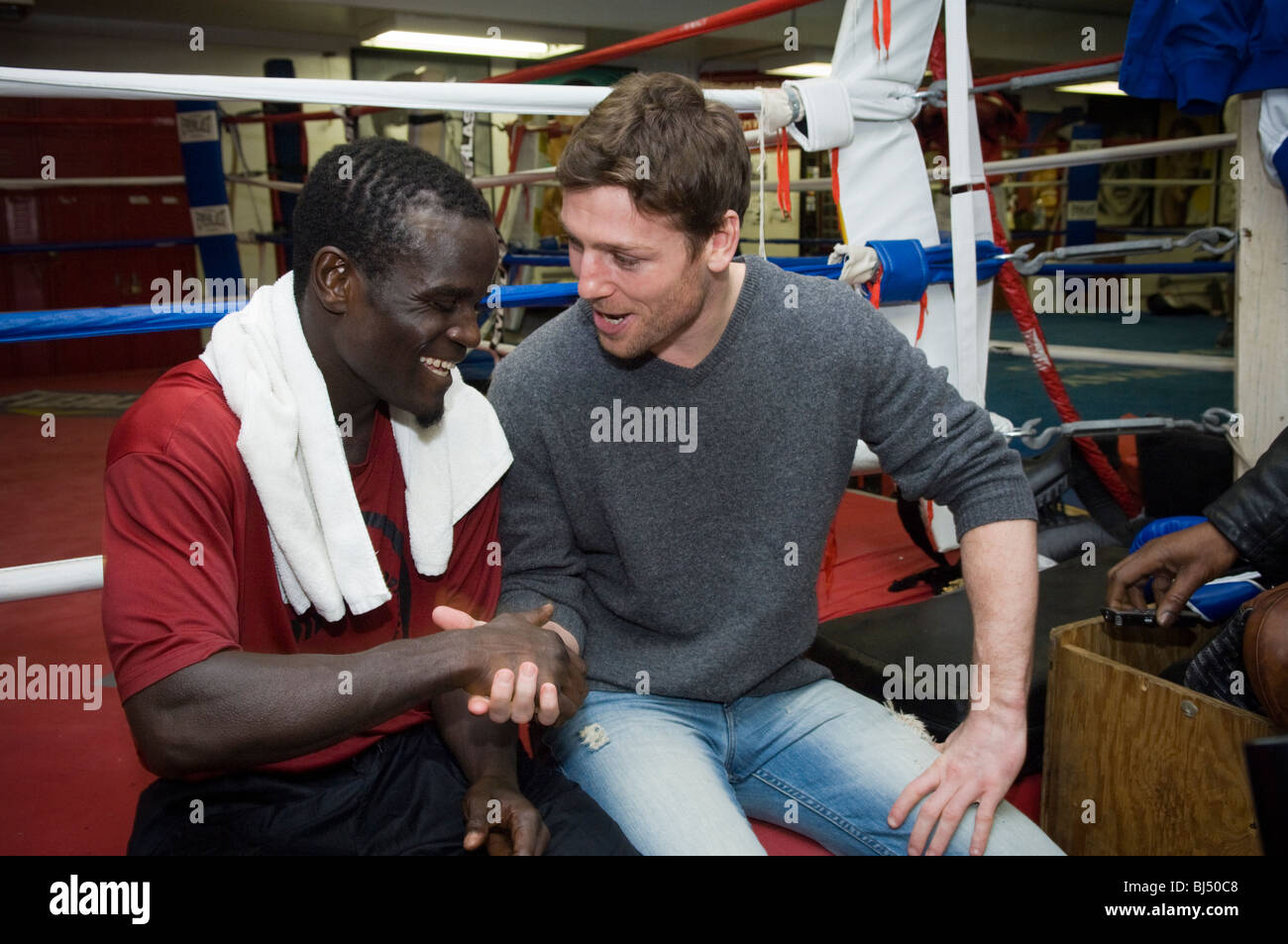 Professional welterweight boxer Joshua Clottey, left, shakes hands with ...