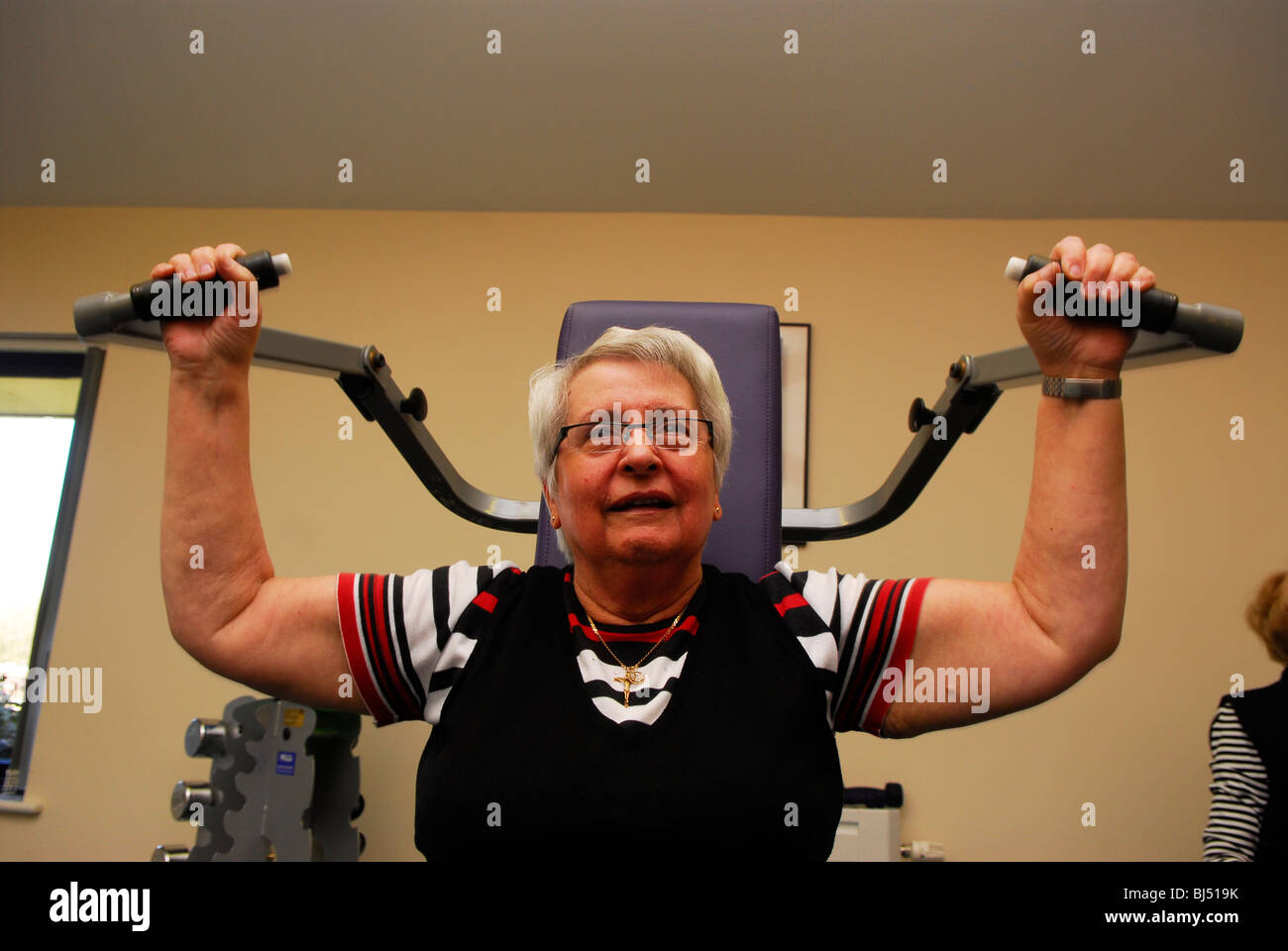 Elderly heart patient engaging in a workout to aid their recovery at a ...