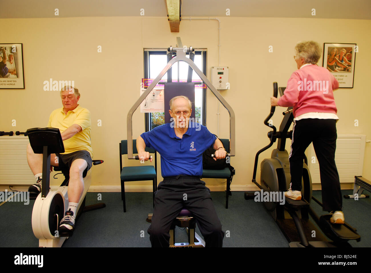 Elderly heart patients engaging in a workout to aid their recovery at a ...