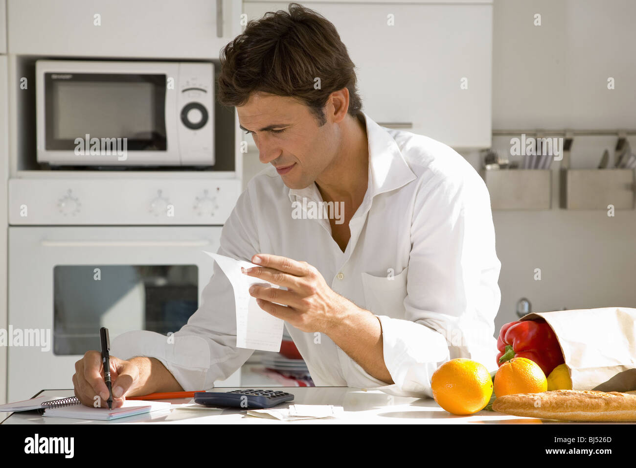 Man paying bills Stock Photo - Alamy
