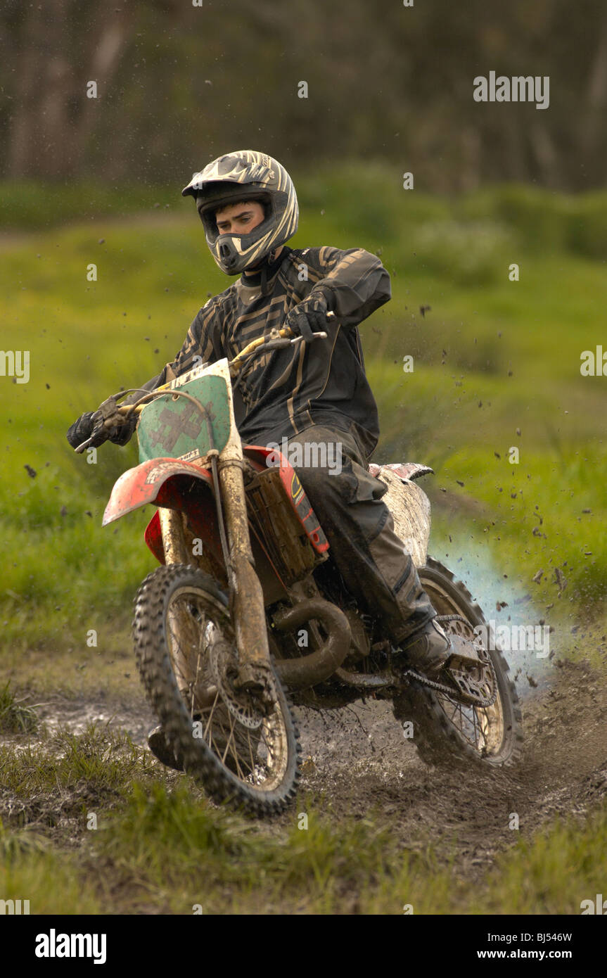Man riding motocross bike in mud and water Stock Photo - Alamy