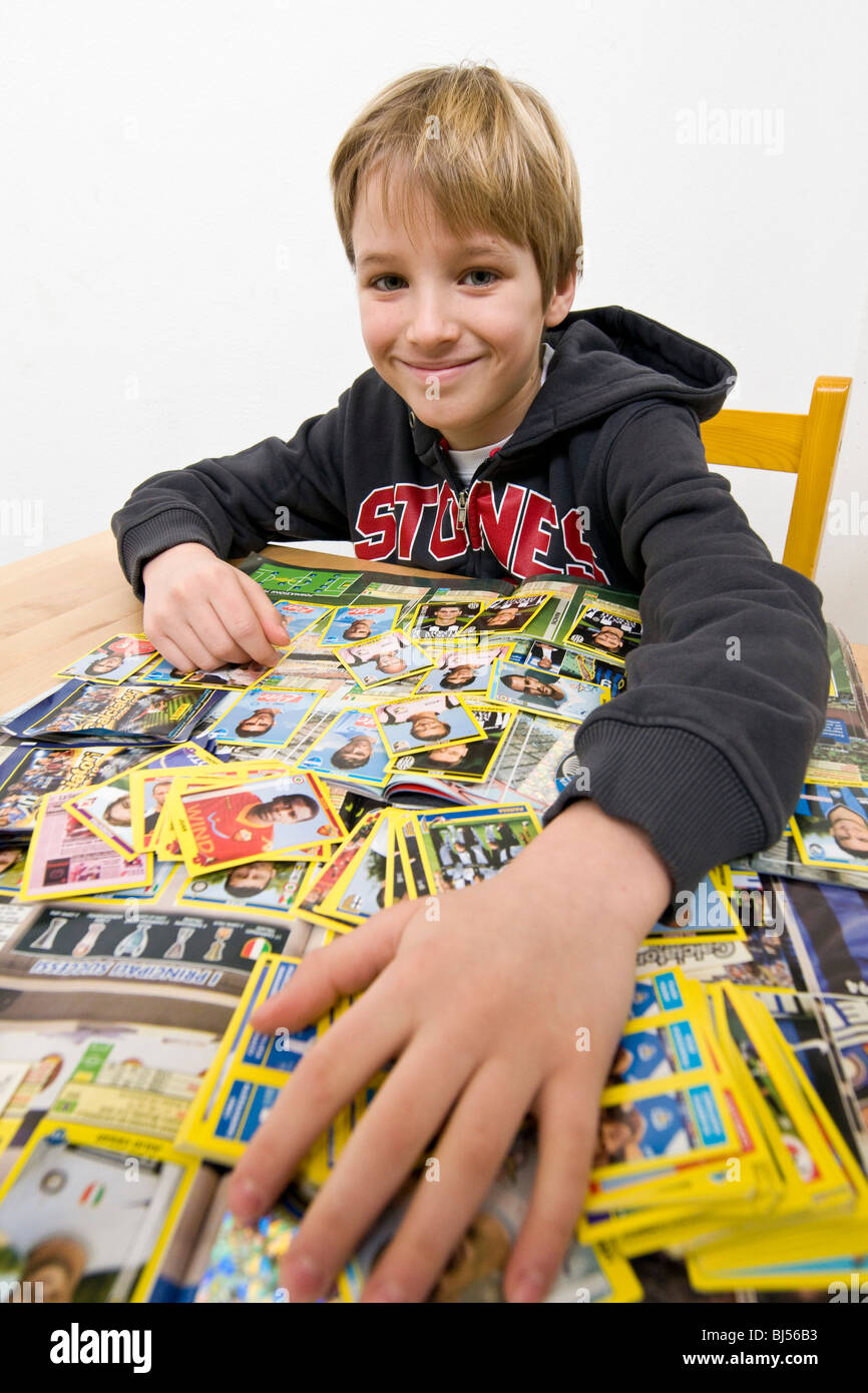 child with football collection cards Stock Photo - Alamy