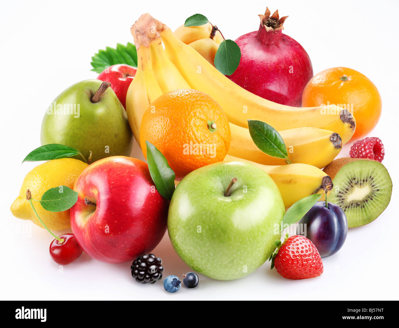 Handful of fruit and berries on a white background Stock Photo - Alamy