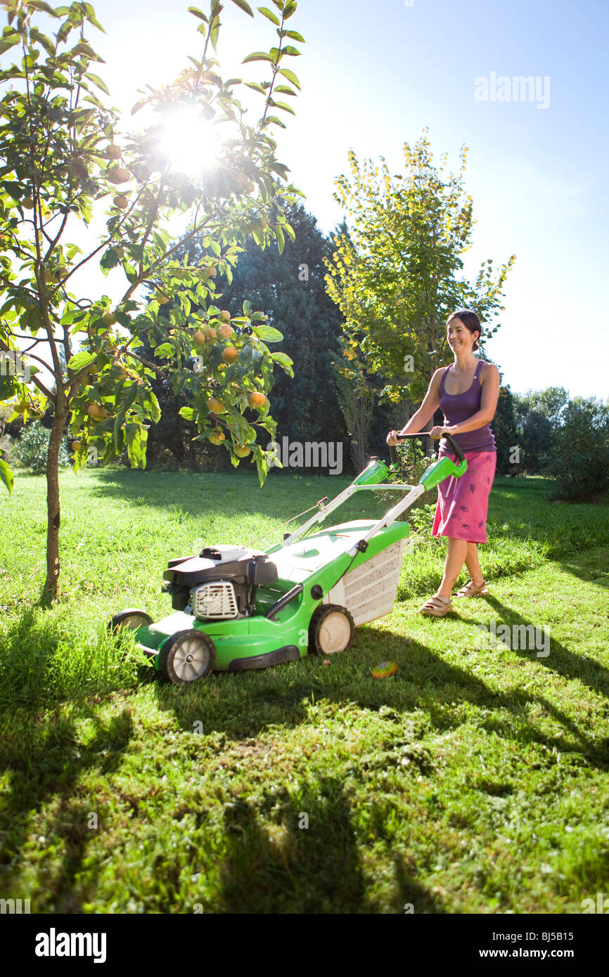 Women mowing lawn hi-res stock photography and images - Alamy