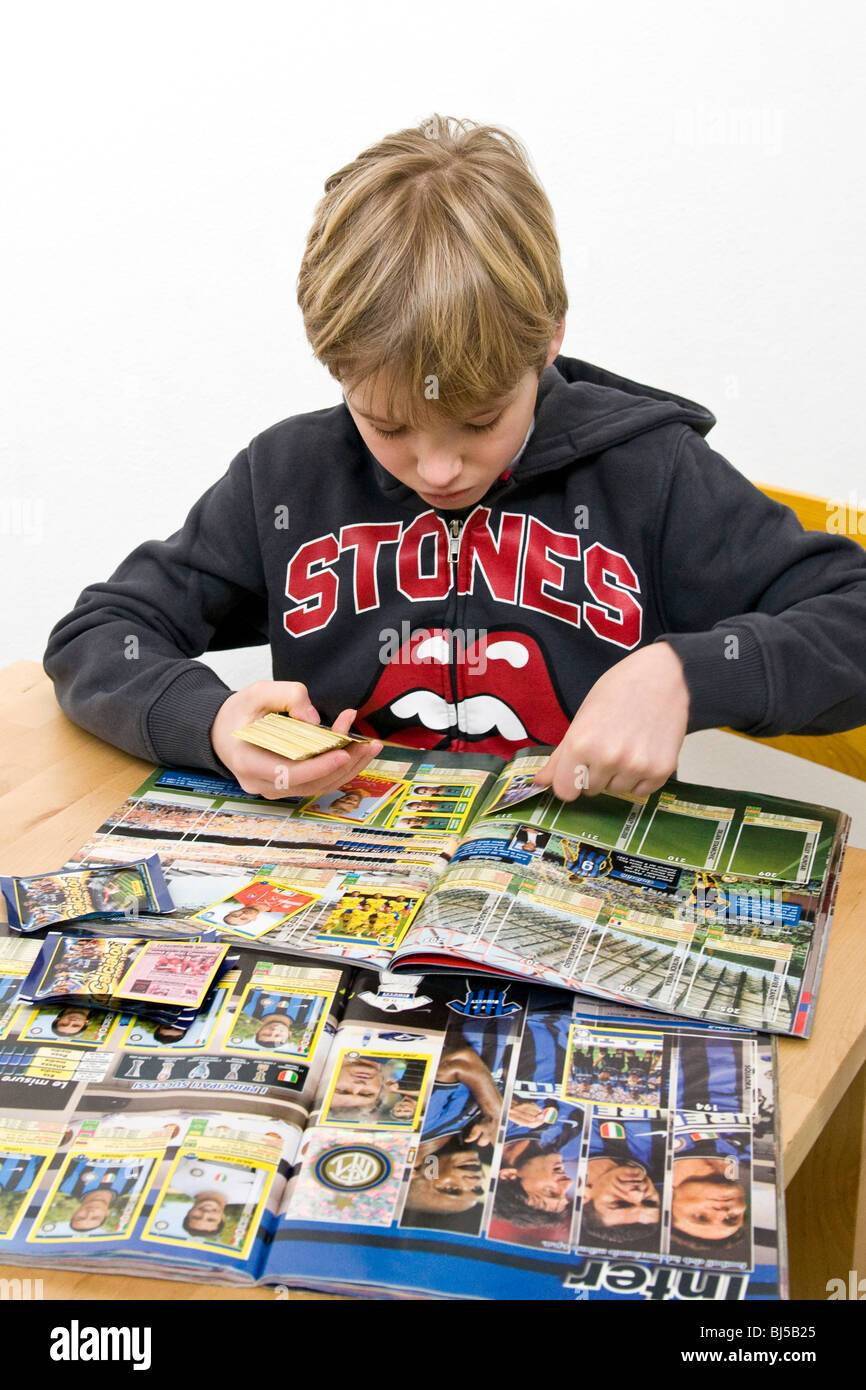 child with football collection cards Stock Photo - Alamy
