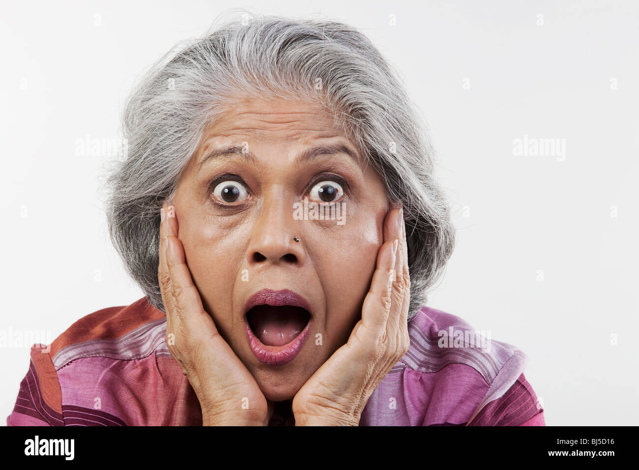 Old woman shocked Stock Photo - Alamy