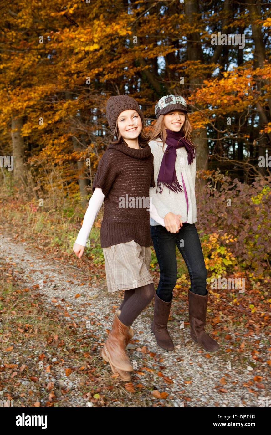 Two girls going for a walk Stock Photo - Alamy