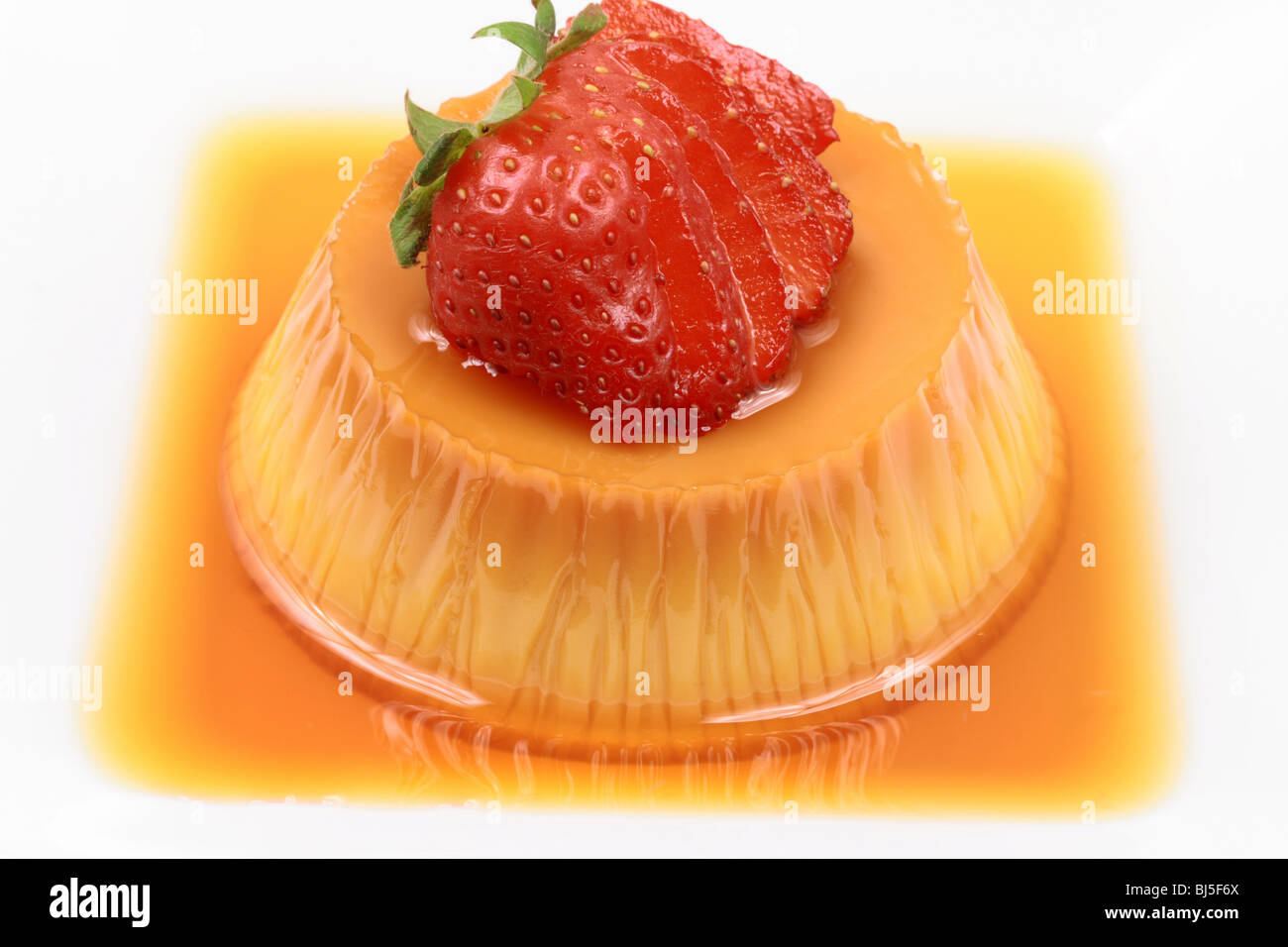Flan dessert made with prime organic milk, berries and garnished with ...