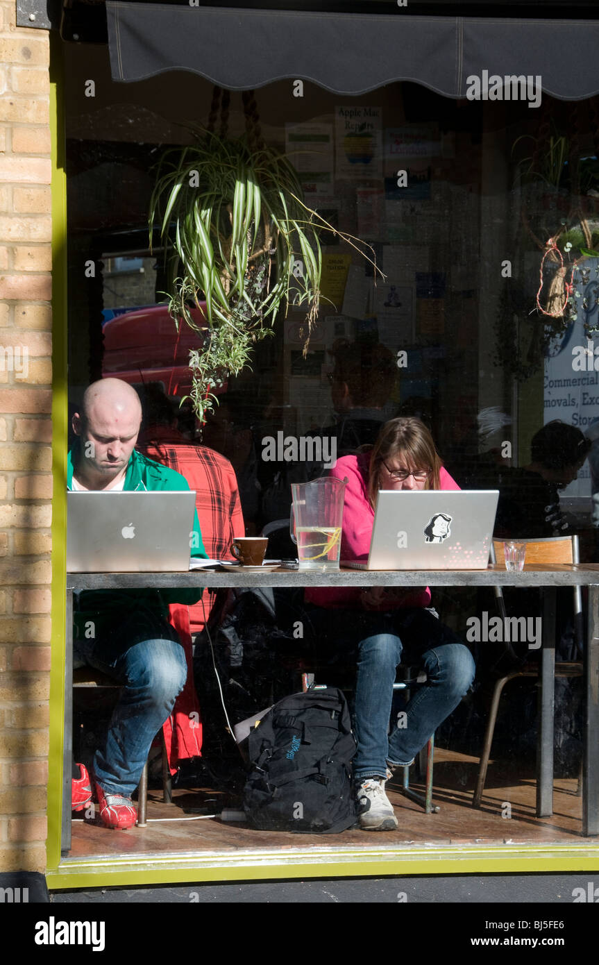 People using laptops at a WiFi cafe in Broadway Market by Regents's ...