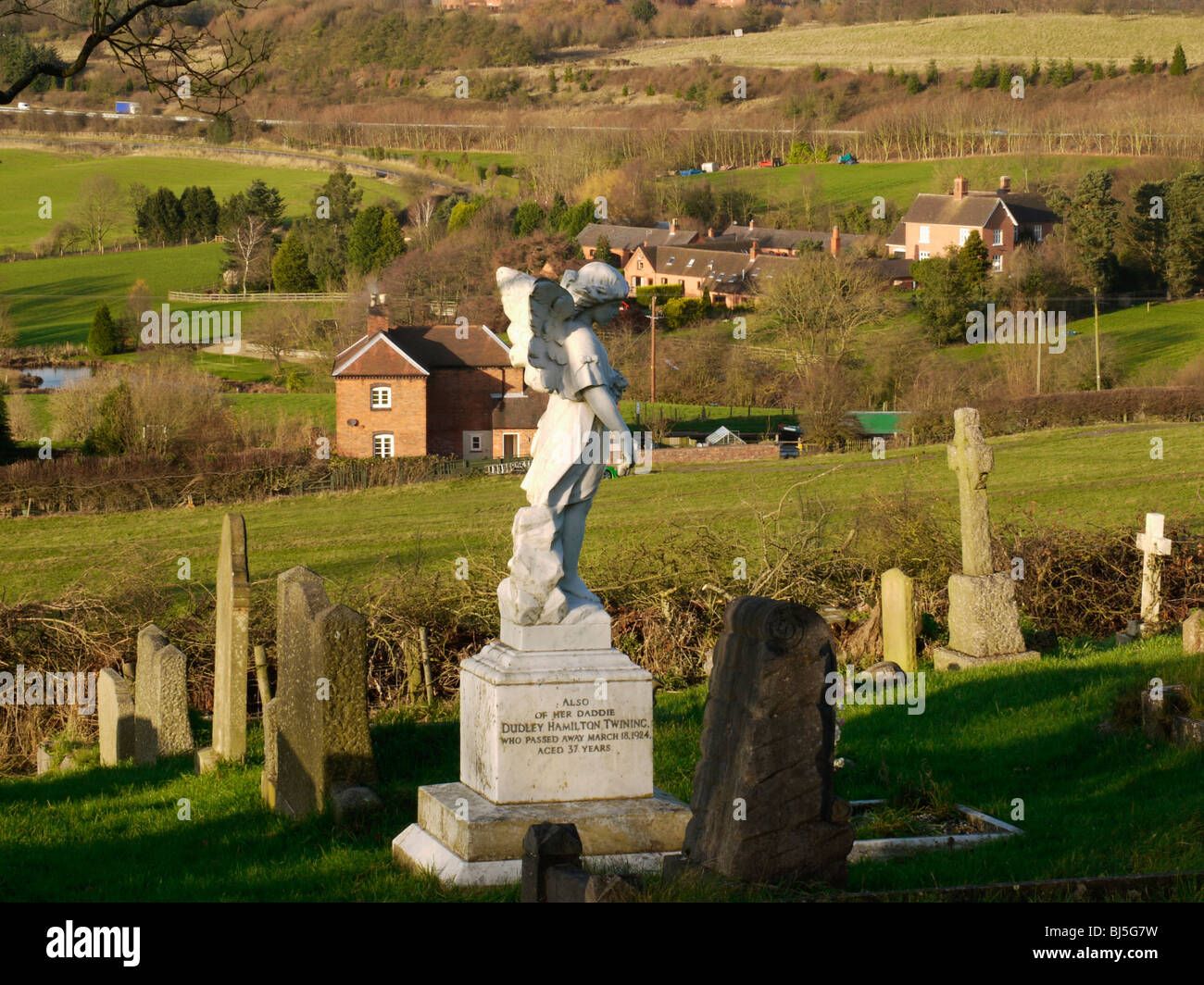 gravestones lit by the sun in a country cemetery Stock Photo - Alamy