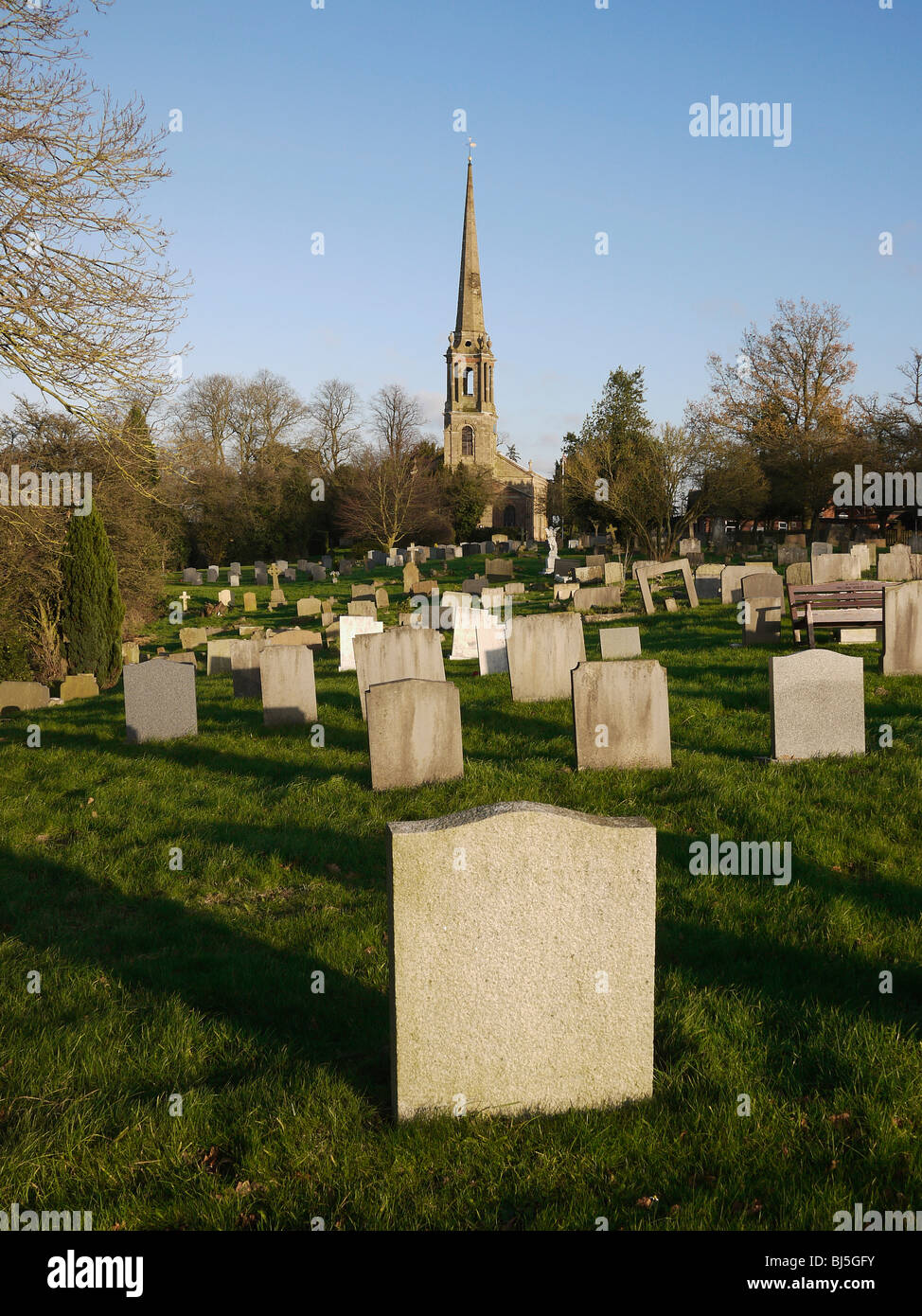 gravestones lit by the sun in a country cemetery Stock Photo - Alamy