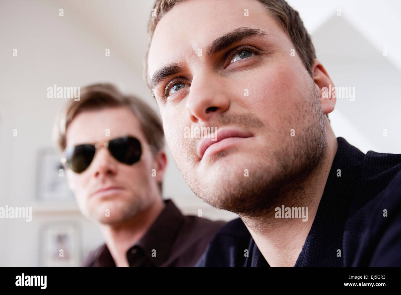 two men looking serious Stock Photo - Alamy