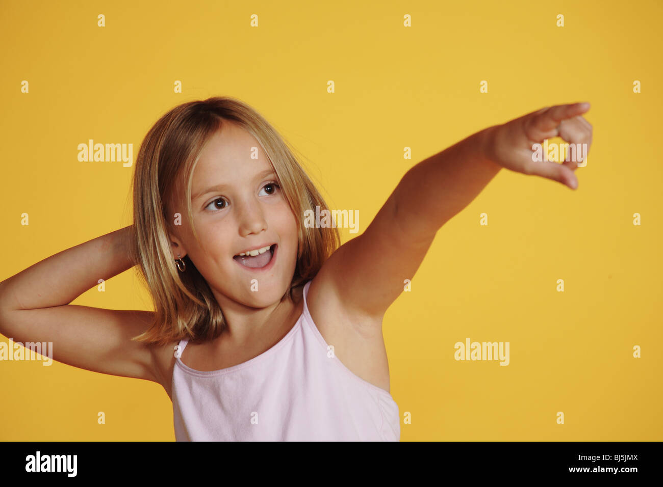 Eight year old girl pointing Stock Photo - Alamy