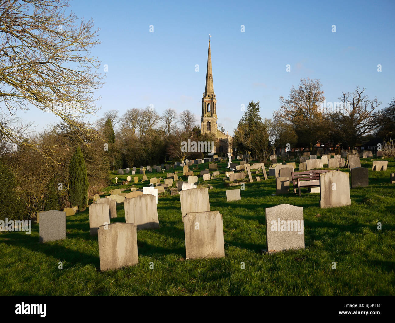gravestones lit by the sun in a country cemetery Stock Photo - Alamy