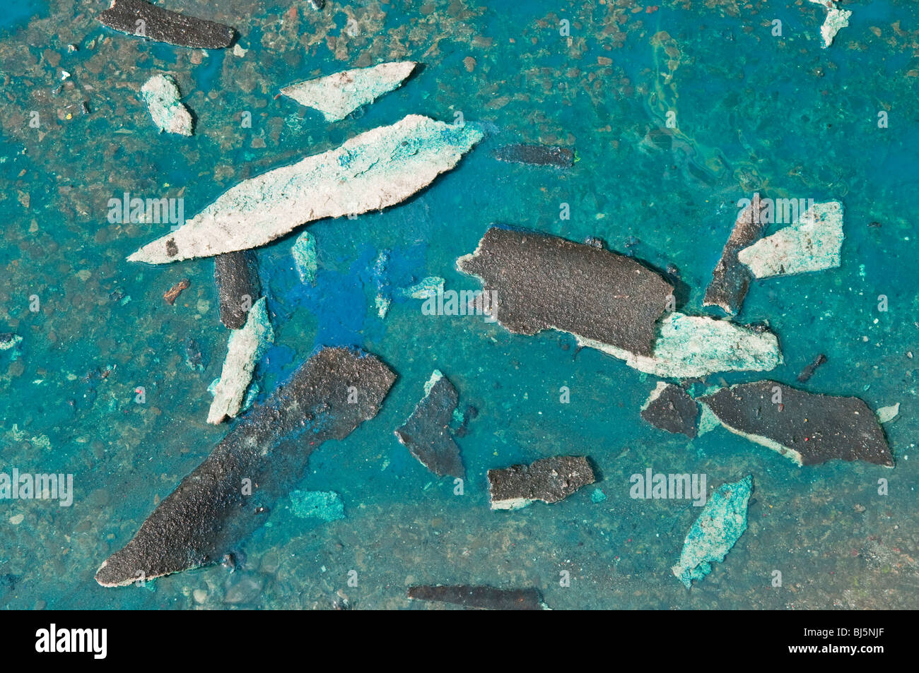 Asbestos cement roof fragments in hazardous chemicals Stock Photo - Alamy