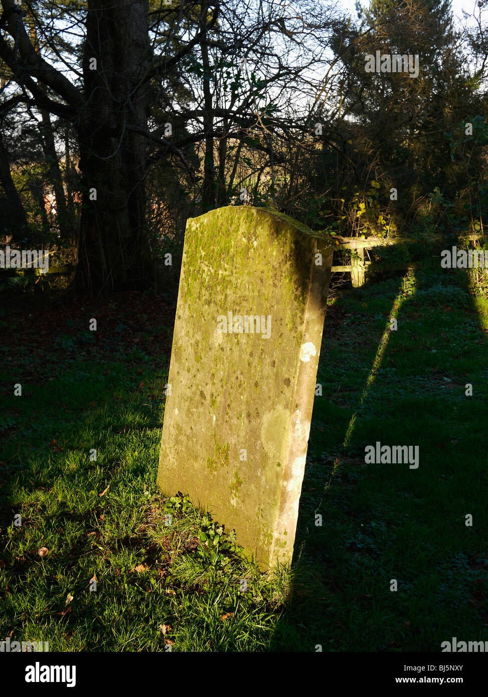 gravestones lit by the sun in a country cemetery Stock Photo - Alamy