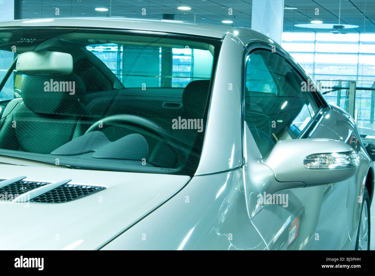 mercedes benz sports car close-up at cars dealership showroom, front ...