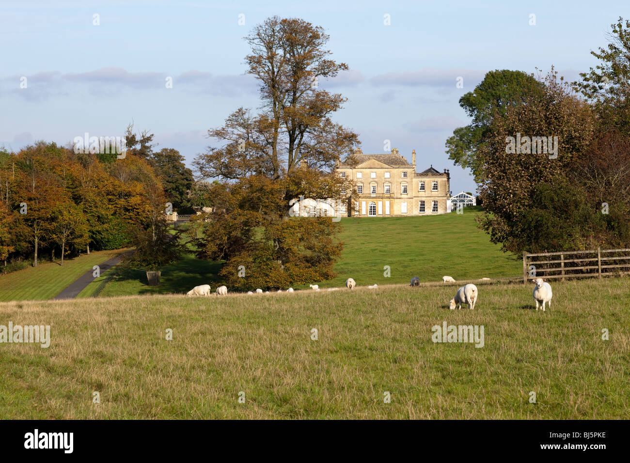 Late afternoon autumn sunlight shining on the west front of Salperton ...