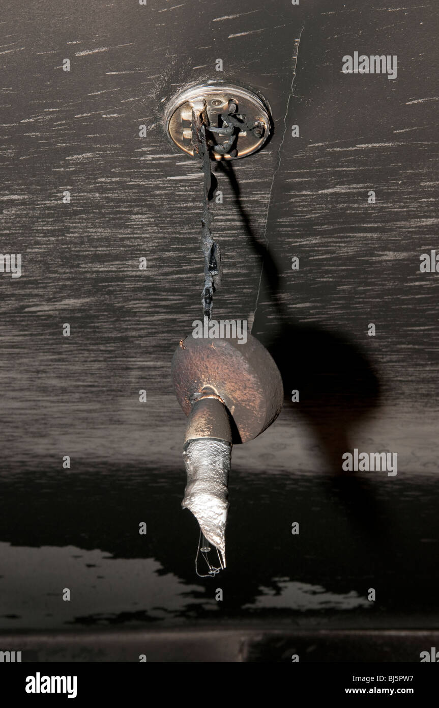 Melted light bulb and fitting at house fire Stock Photo - Alamy