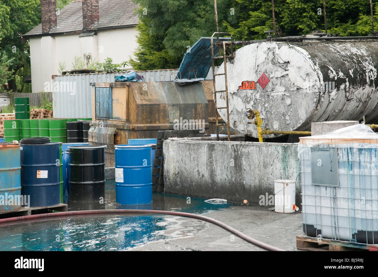 Leaking dangerous chemical tank at factory Stock Photo - Alamy