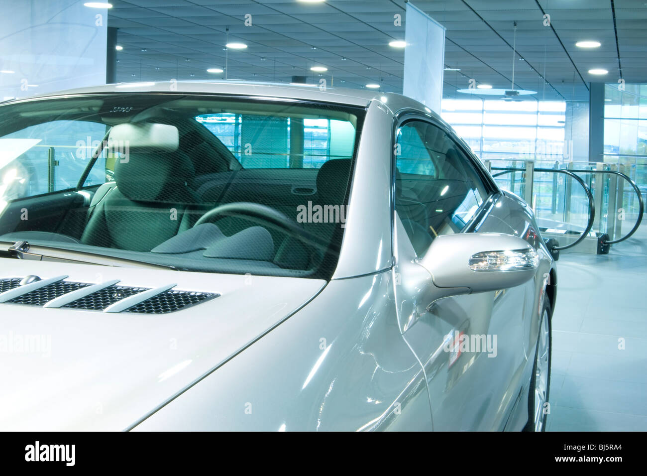 mercedes benz sports car close-up at cars dealership showroom, front ...