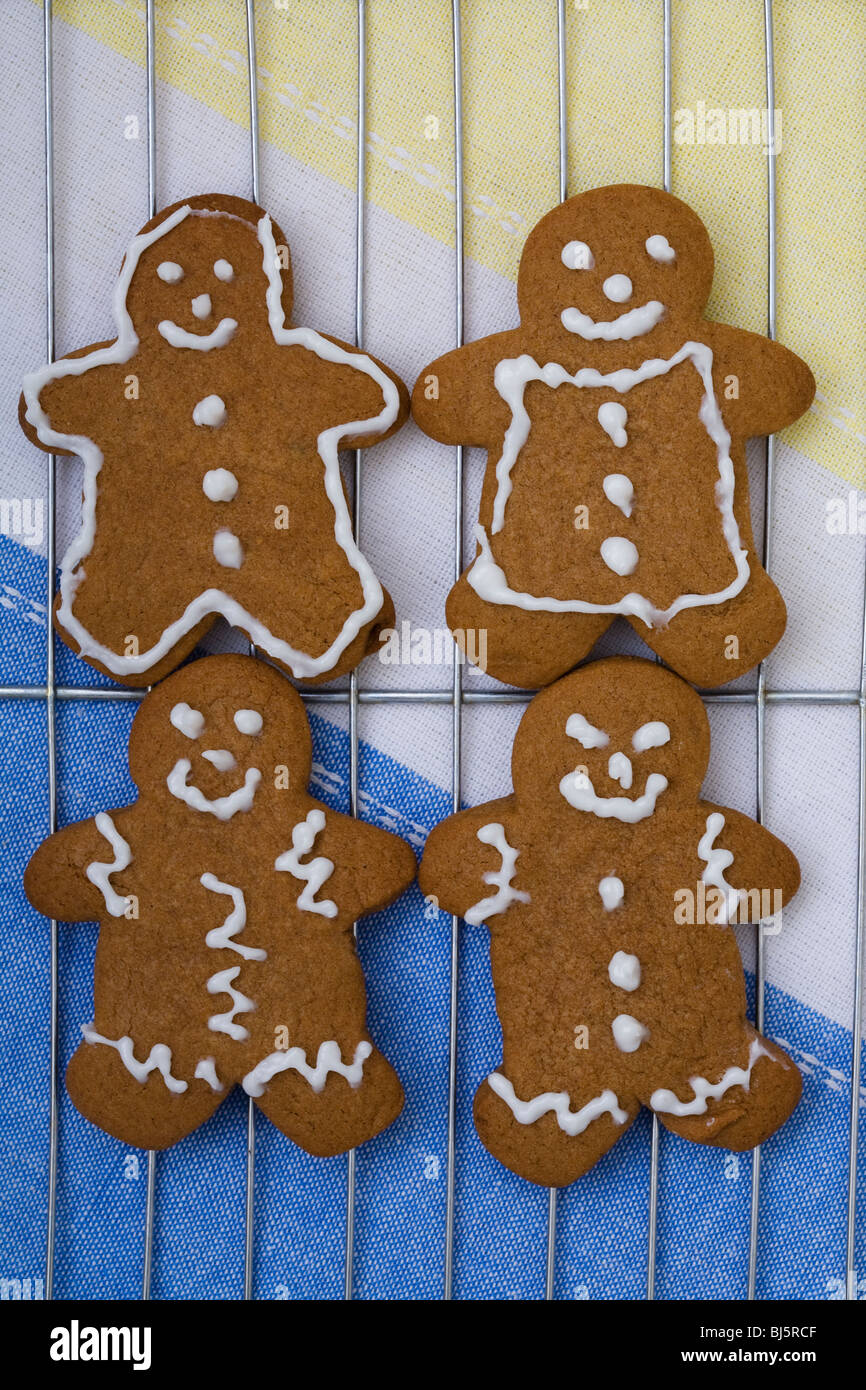 Four gingerbread people Stock Photo - Alamy
