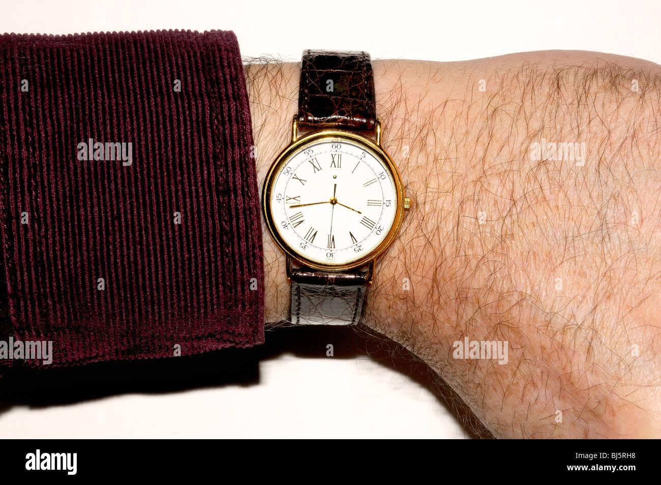 Expensive watch on man's arm. (Movado Stock Photo - Alamy