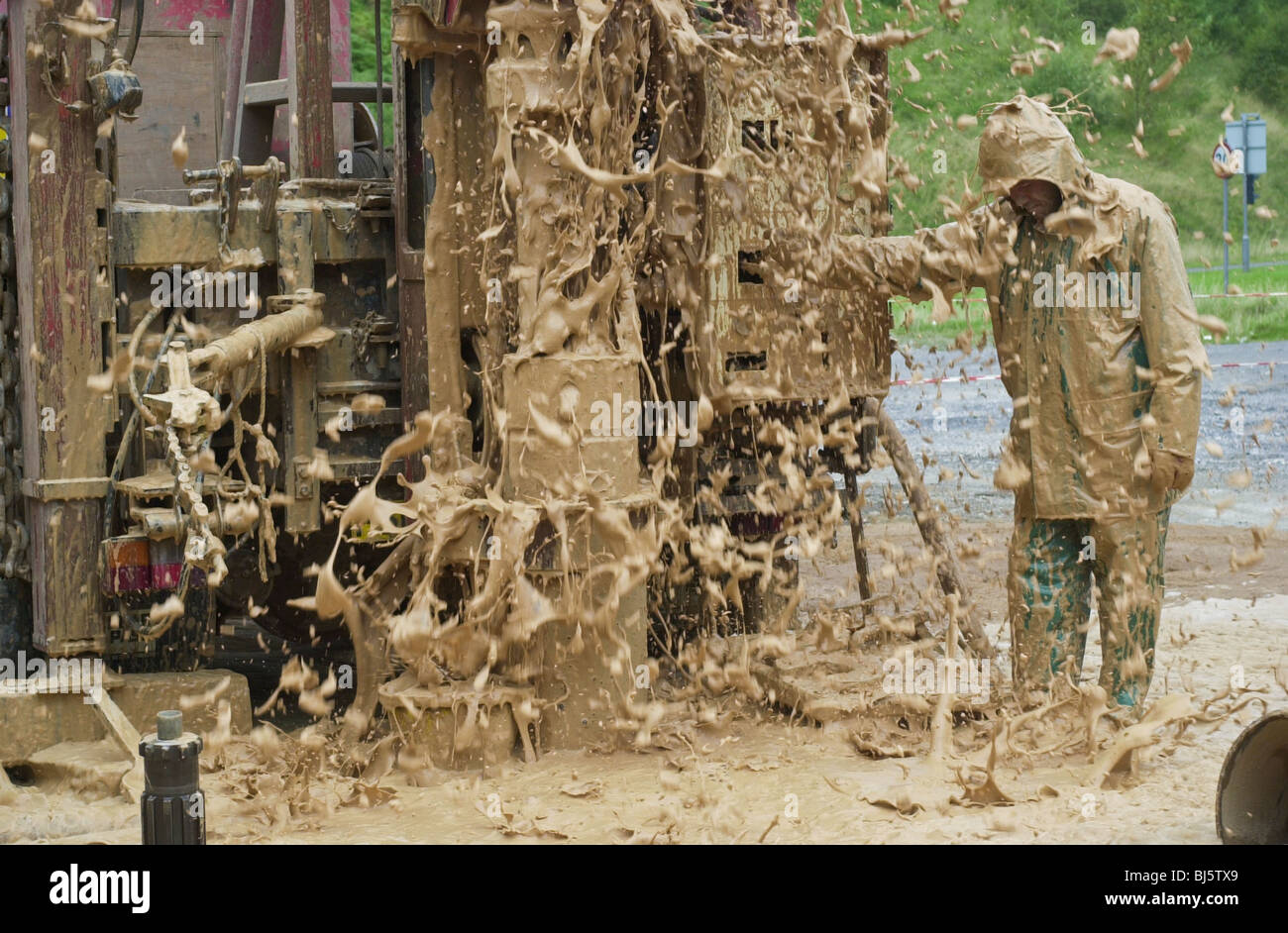 Engineer covered in foam and mud while drilling for water at Gwalia ...