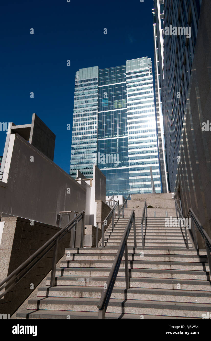 Stone stairs lead up to a modern steel and glass office block Stock ...