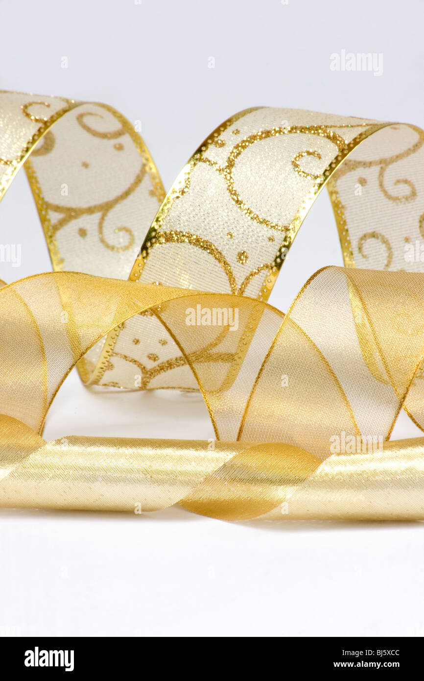 Ribbon ribbons golden reel unwound hi-res stock photography and images ...