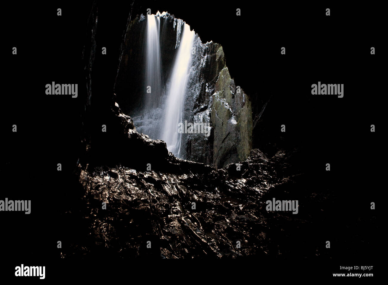 Waterfall inside a cave in Wales Stock Photo - Alamy