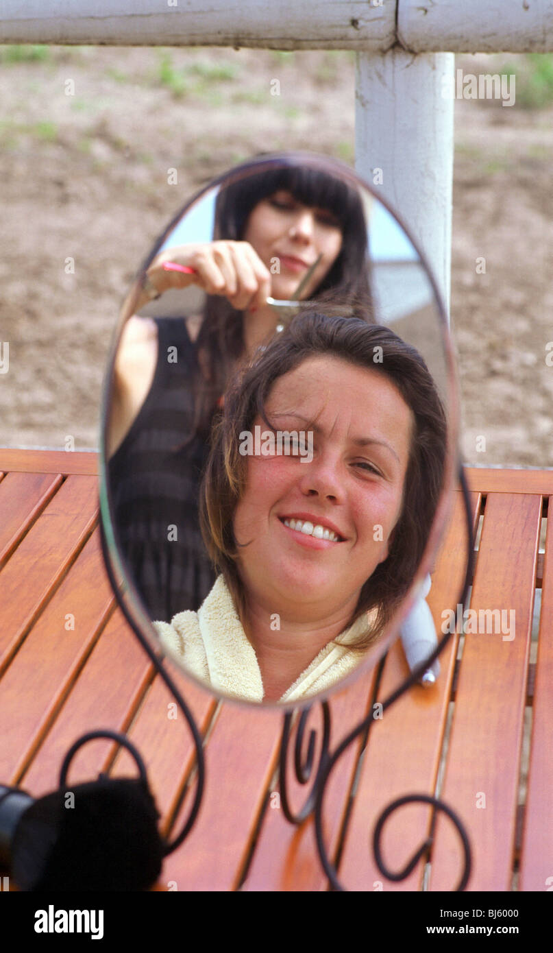 Female mobile hairdresser cutting hi-res stock photography and images ...