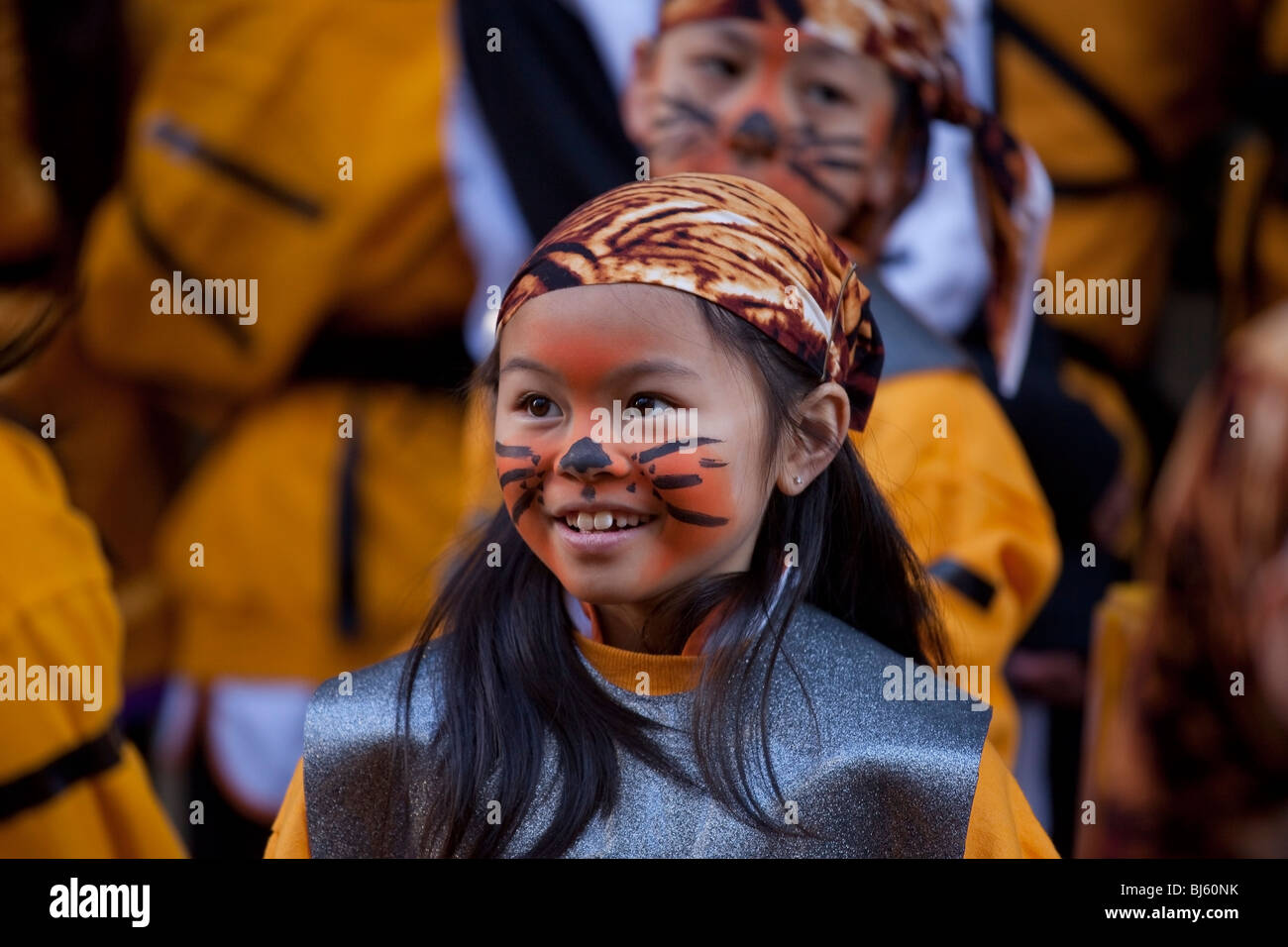 Chinese girl in tiger costume and face painted for Chinese New Year ...