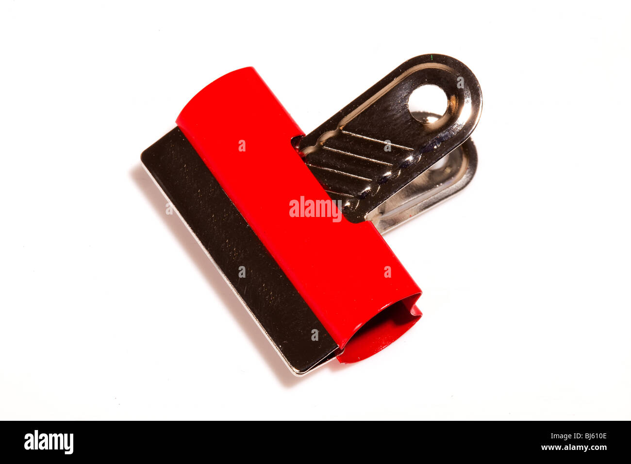 Red Paper Clamp on an Isolated White Background Stock Photo - Alamy