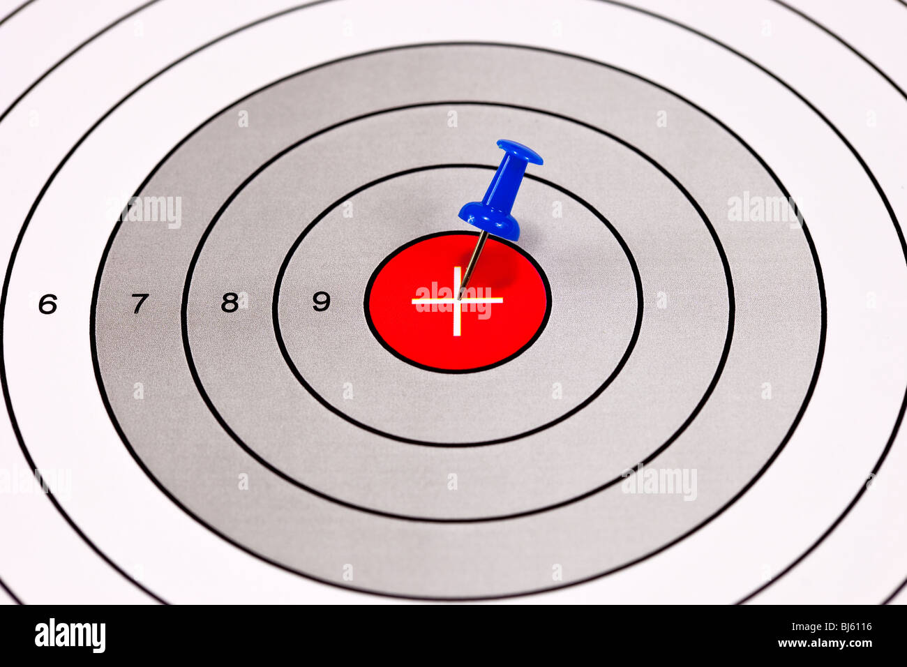 Blue Pin in a Red Centered Target With Crosshair Stock Photo - Alamy