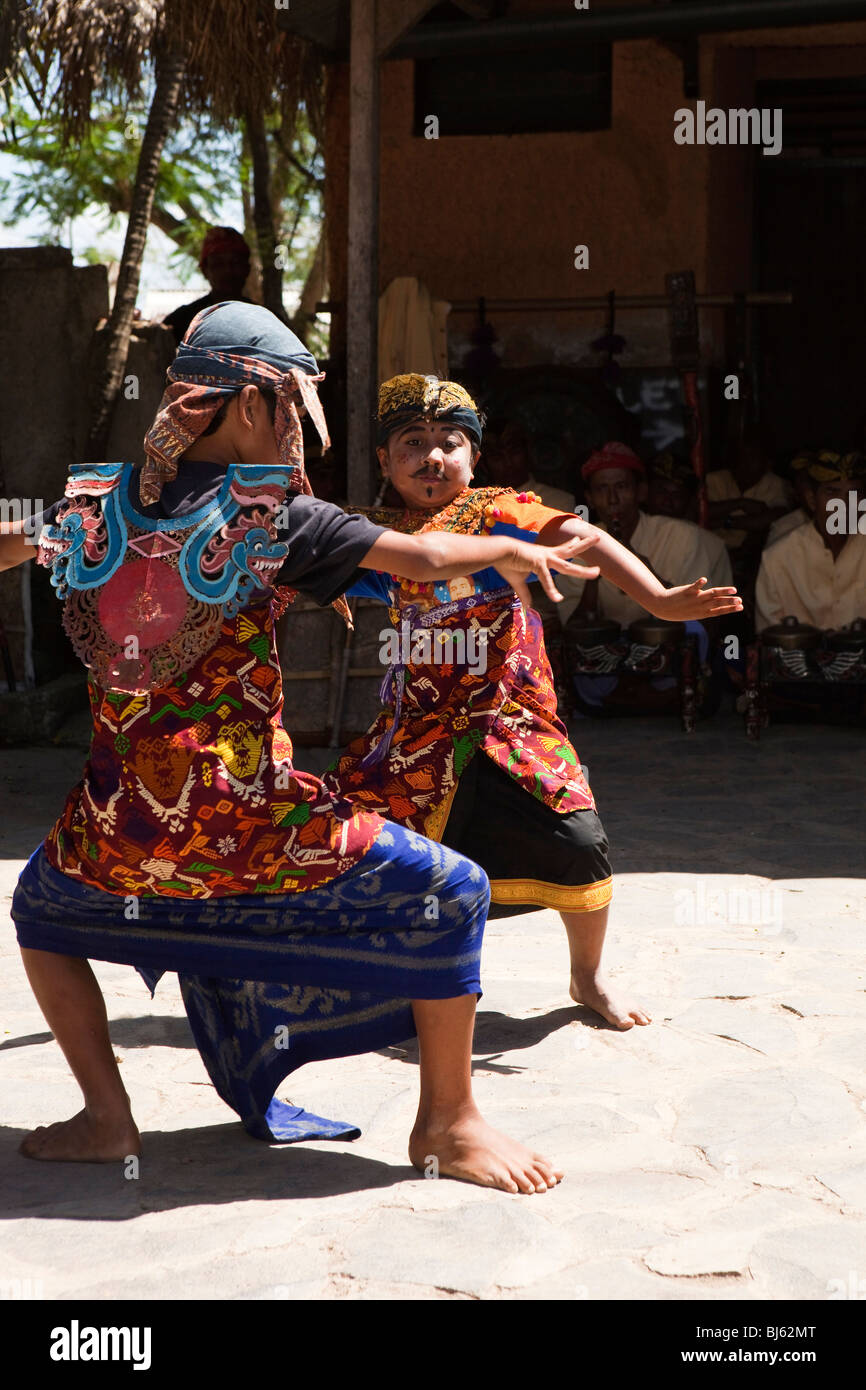 Indonesia, Lombok, Sade, traditional Sasak village, two boys dancing to ...