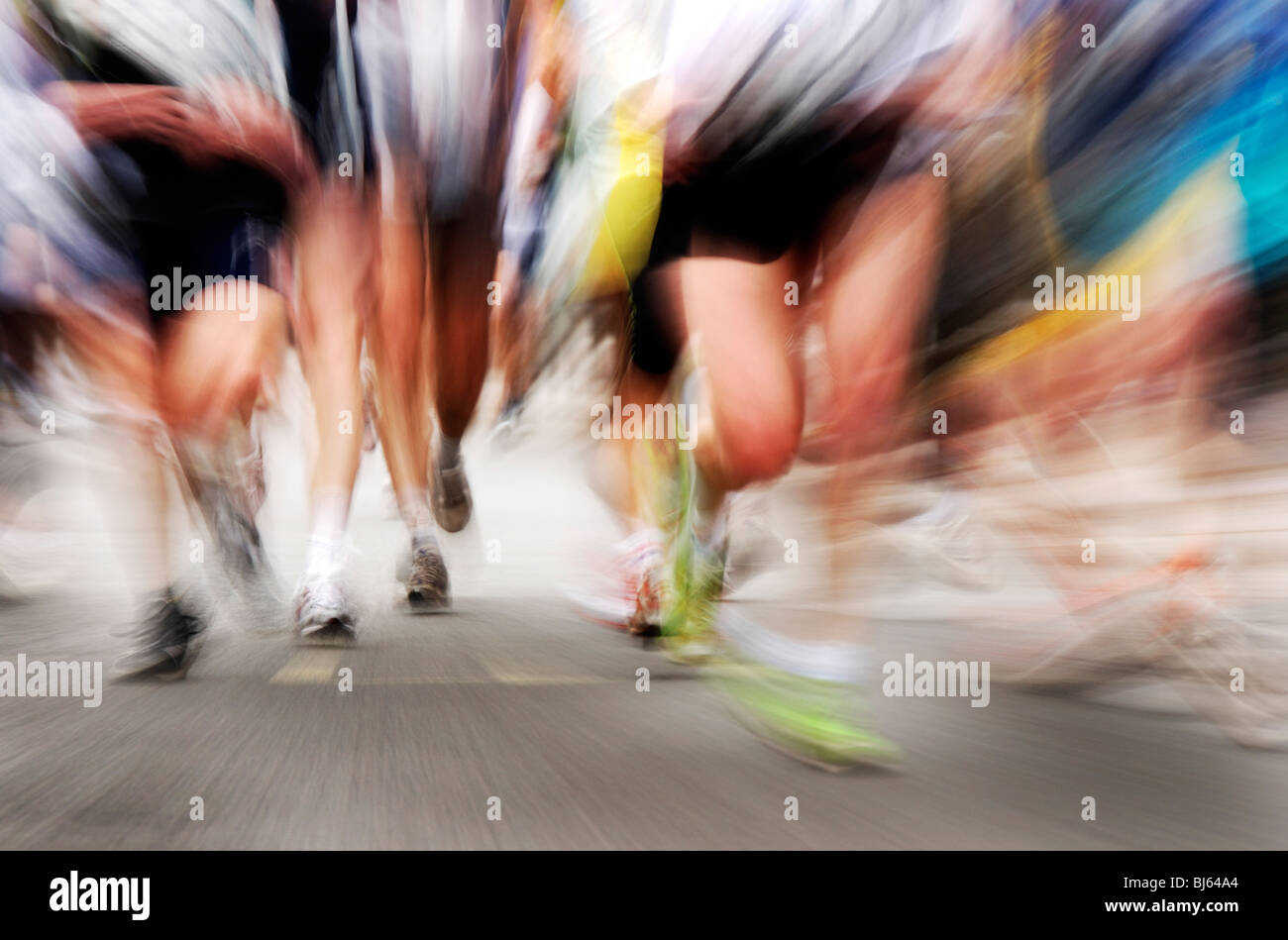 marathon runners legs - zoom panning effect Stock Photo - Alamy