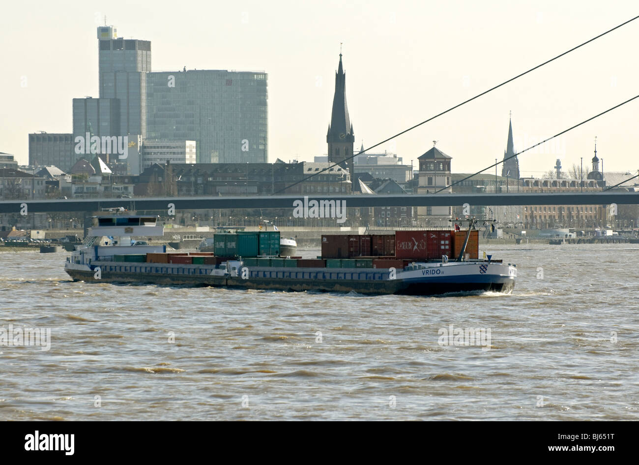 Barge on the Rhine with view of Oberkassel Bridge and Düsseldorf ...