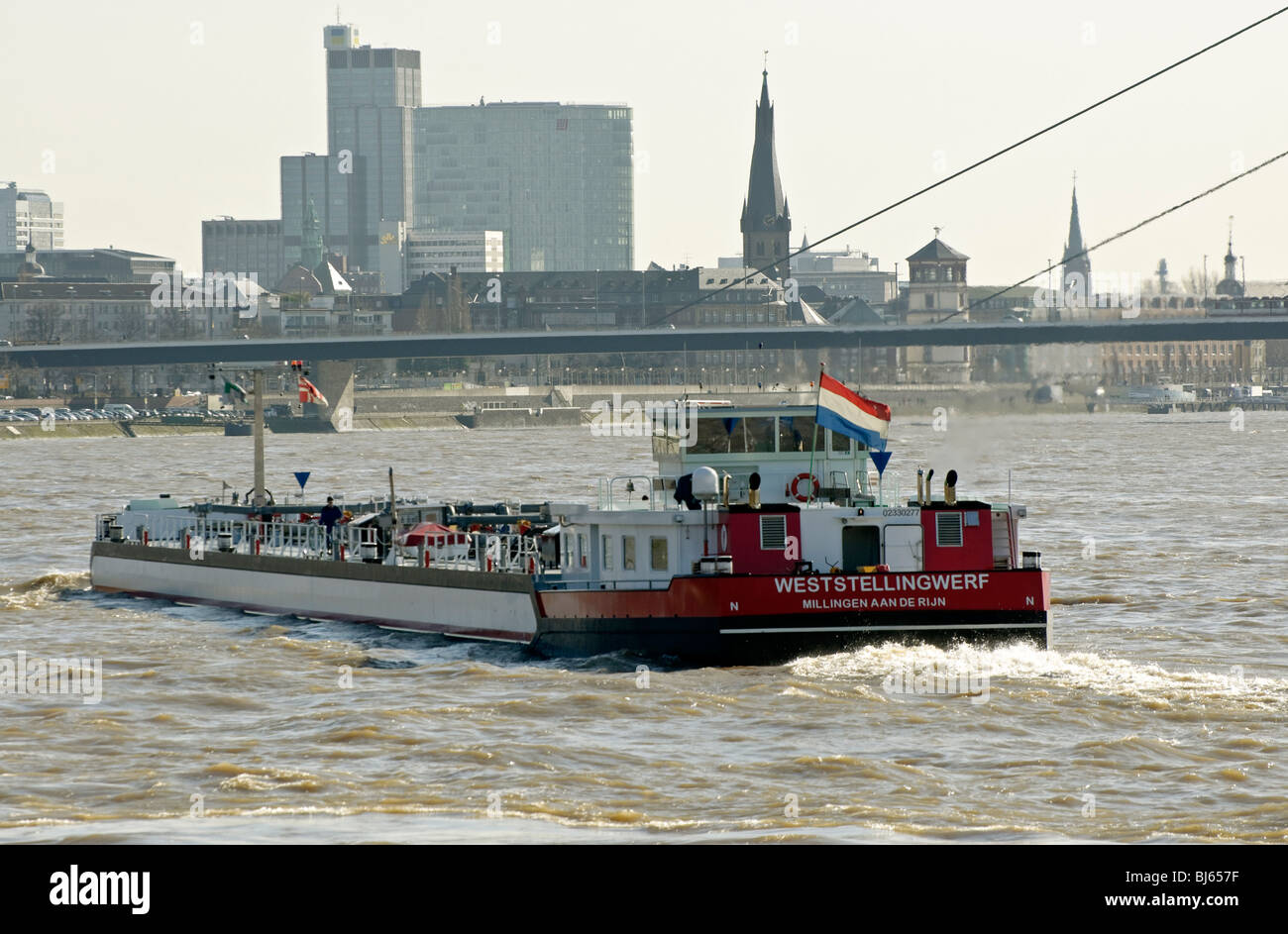 Barge on the Rhine with view of Oberkassel Bridge and Düsseldorf ...