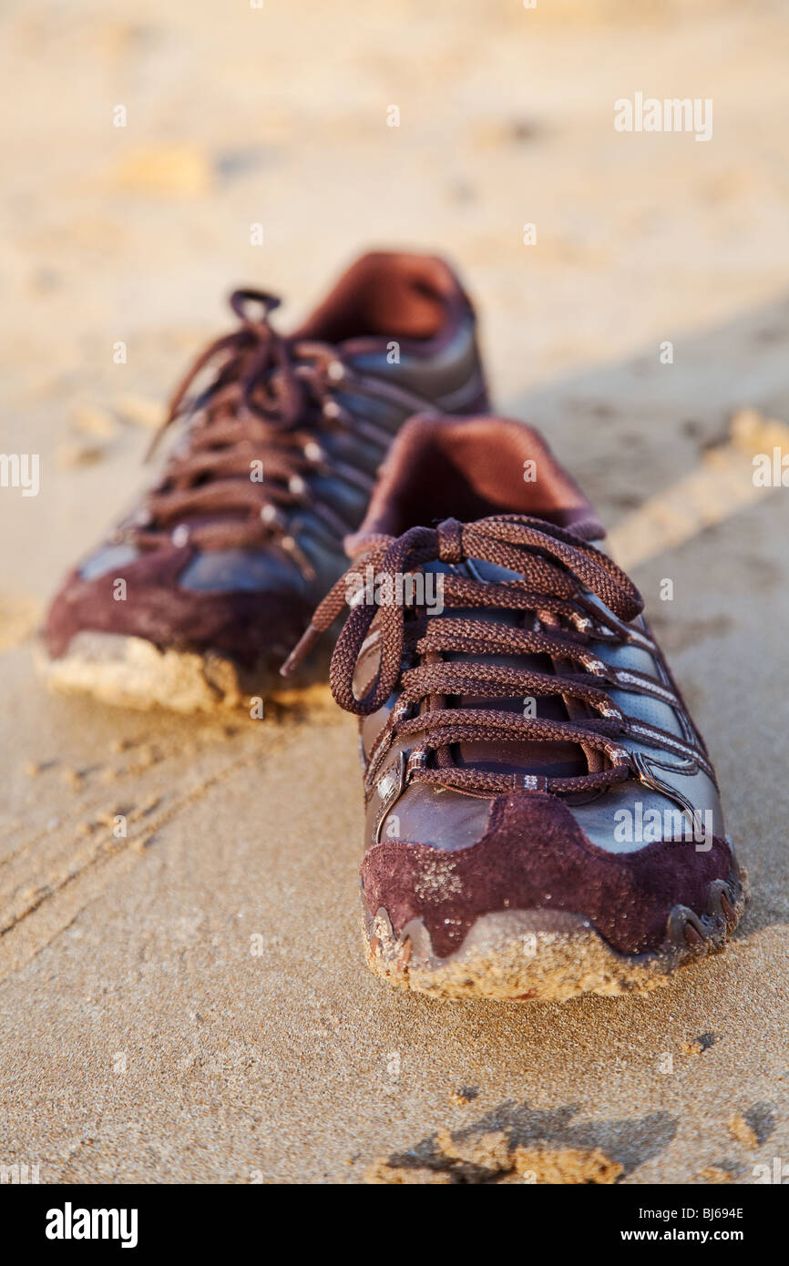 shoe and sand background Stock Photo - Alamy