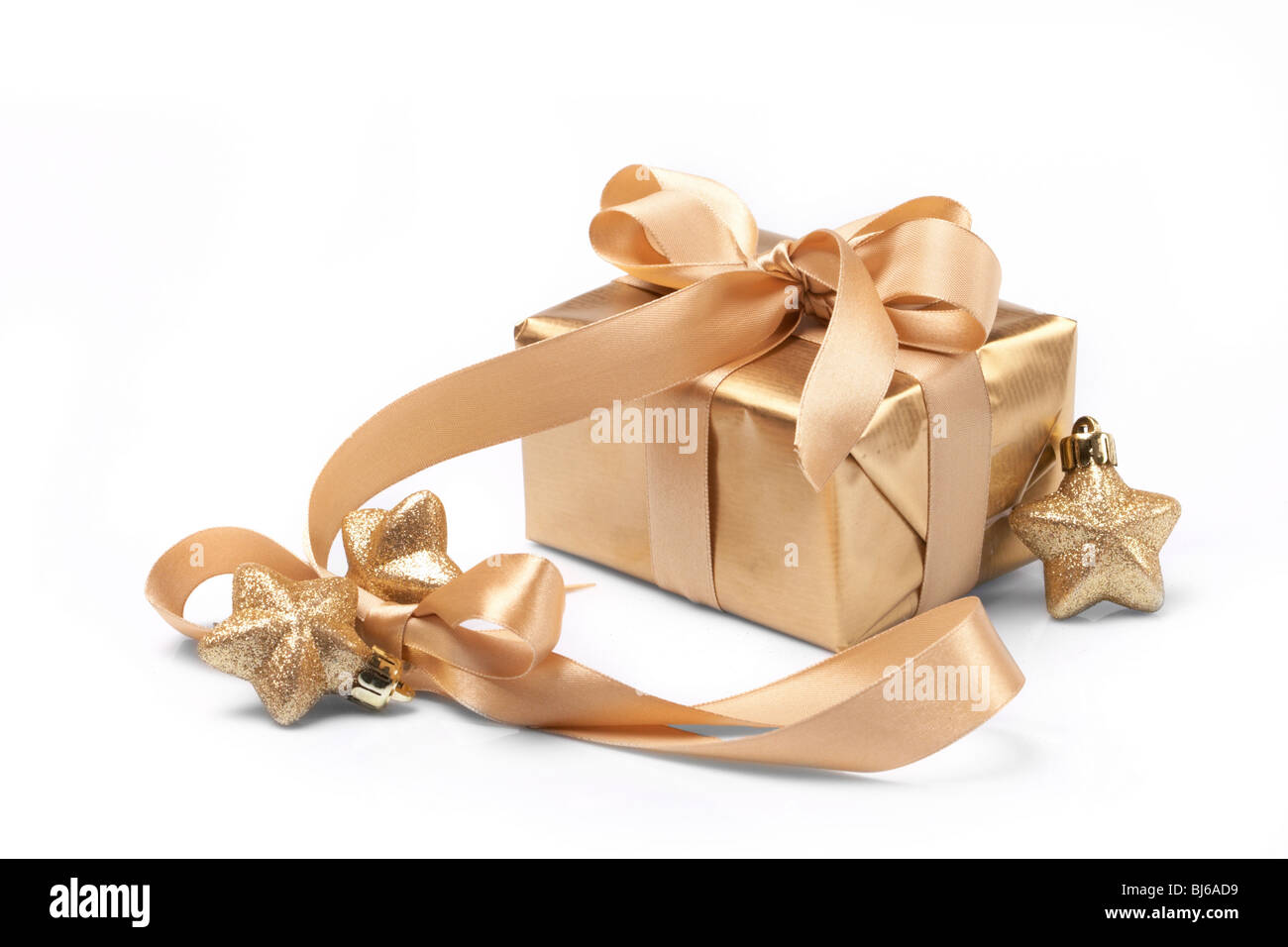 Beautiful golden gift Stock Photo - Alamy