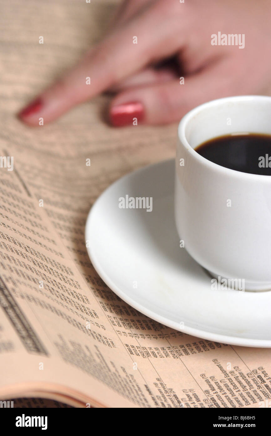 newspaper and womans hand Stock Photo - Alamy