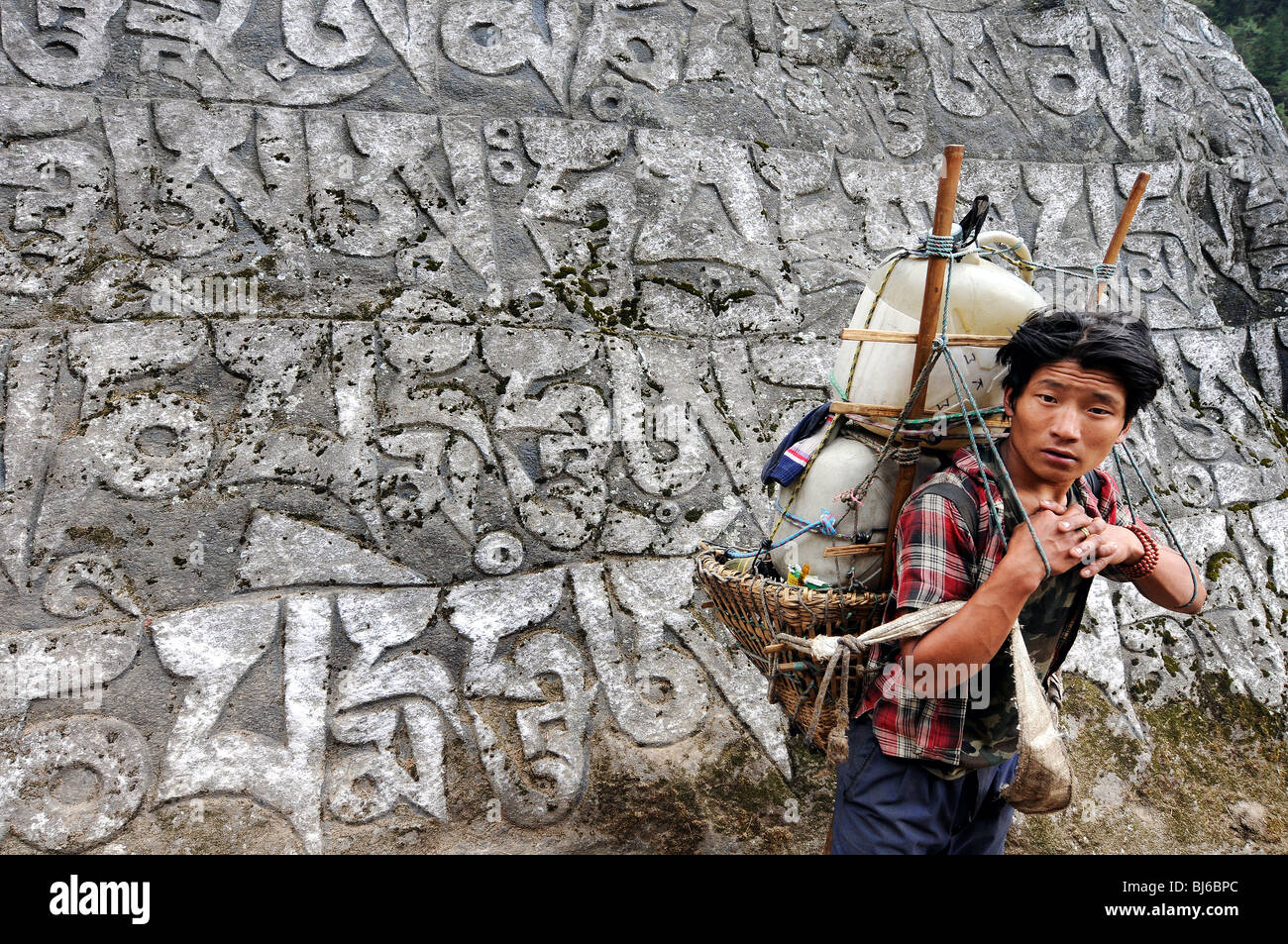 Porter in Benkar, Nepal Stock Photo - Alamy