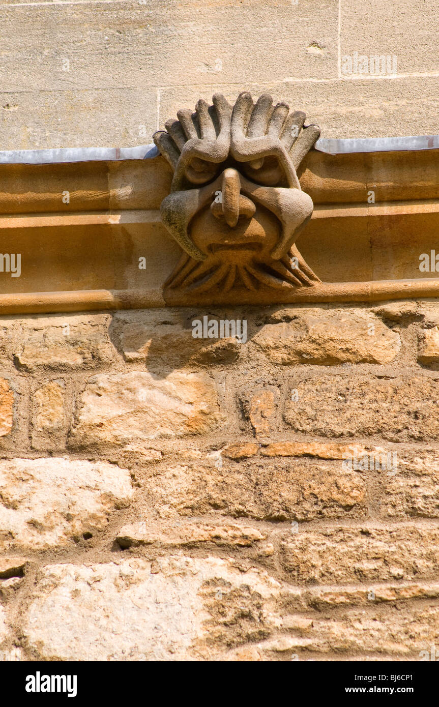 an angry looking gargoyle in New College Lane Oxford UK Stock Photo - Alamy