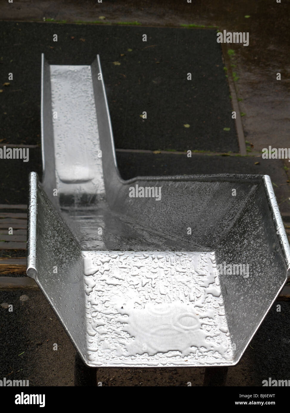View from top of child's chute in rain Stock Photo - Alamy